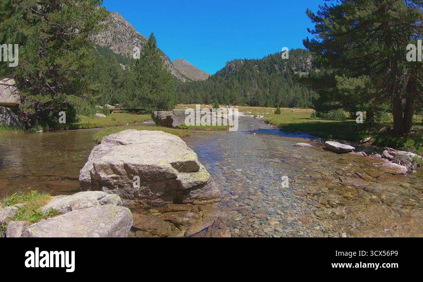 Beautiful Pyrenees mountain landscape, nice lake with transparent water ...