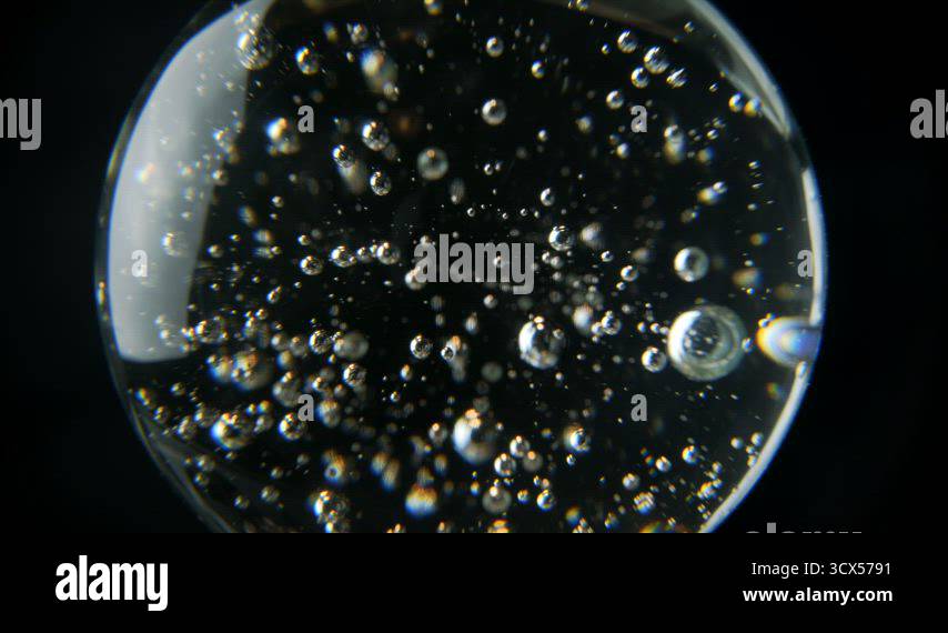 Bubbles trapped in glass orb Stock Video Footage - Alamy