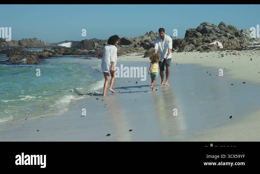 WS SLO MO Family with daughter (4-5) running on beach, Claremont, Cape ...