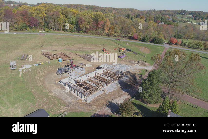 Aerial view of an old timber frame barn being rebuilt and restored ...