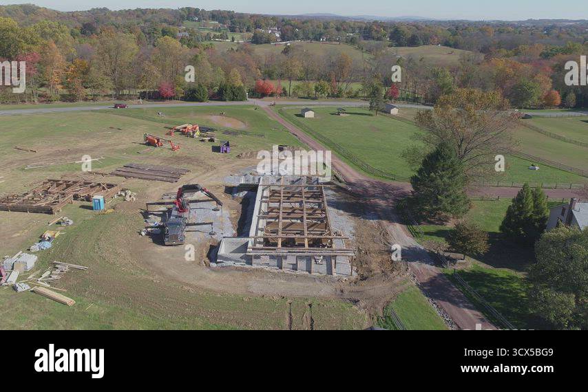 Aerial view of an old timber frame barn being rebuilt and restored ...