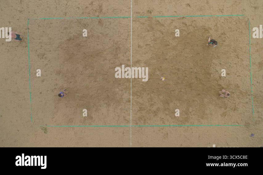 Mixed Teams are Playing Beach Volleyball. Aerial Vertical Top-Down View ...