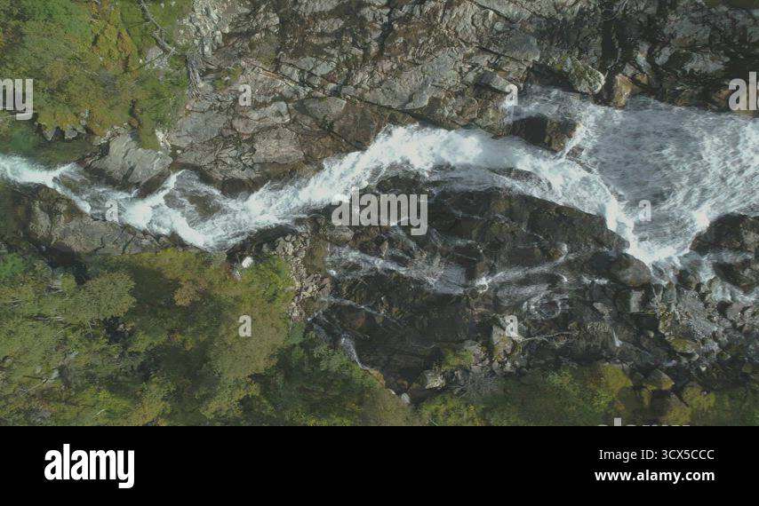 Waterfall, Rocks and Green Trees in Norway. Aerial Vertical Top-Down ...