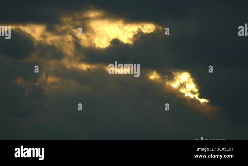 sunset orange yellow sky cloud moving on silhouette storm cloud Stock ...