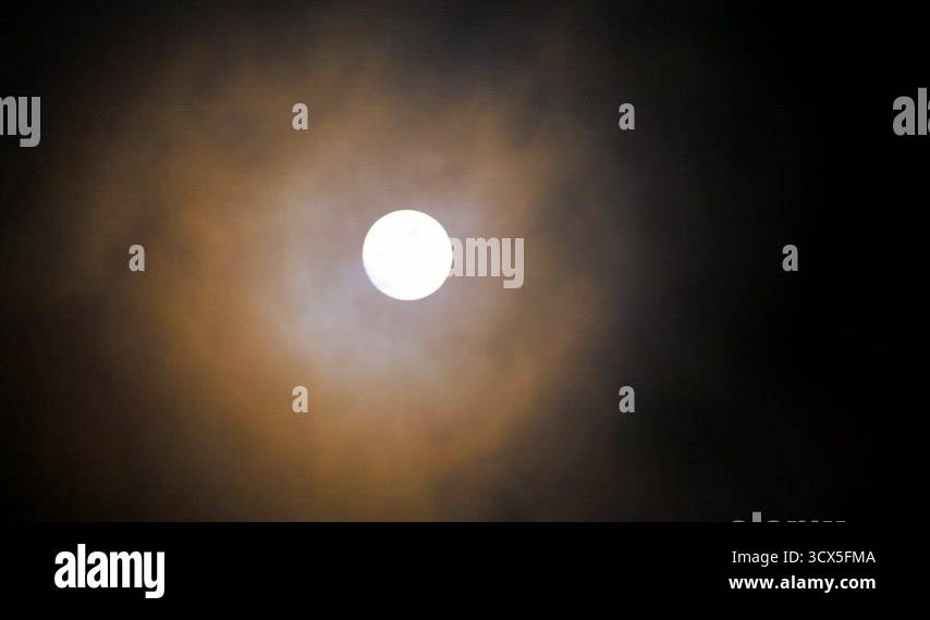 full moon orange moonlight on the night sky and cloud passing Stock ...