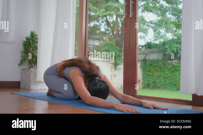 End step by pretty girl action of yoga posture Upward Stretch by lie ...