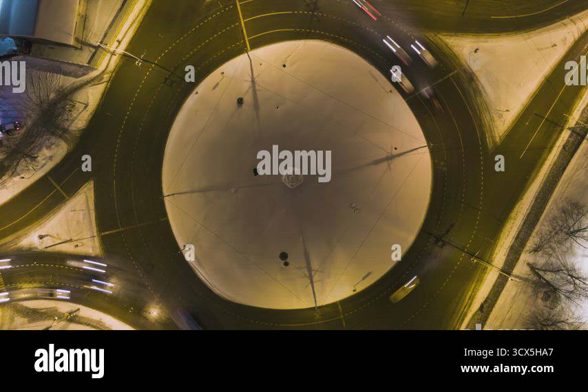 Illuminated Traffic Circle in the City and Cars at Winter Night. Round ...