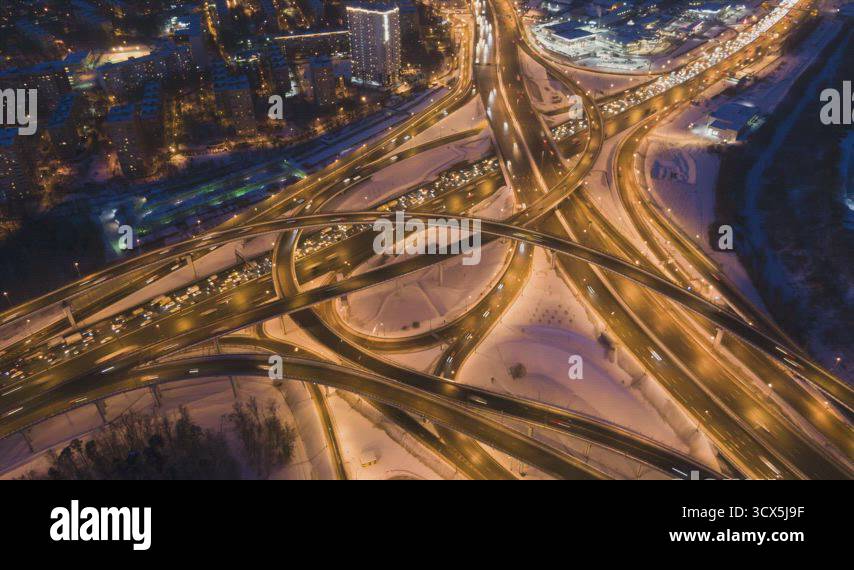 Illuminated Road Junction and Cars Traffic at Winter Night in Urban ...
