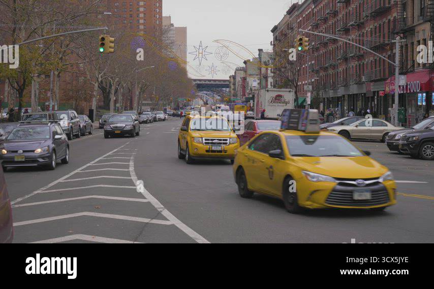 NEW YORK CITY, USA - NOVEMBER 25, 2018: Cars on a Road in Harlem Black ...