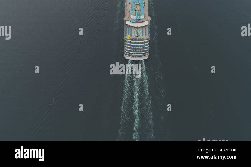 Large Luxury Cruise Ship is Going in Fjord of Norway. Aerial Vertical ...