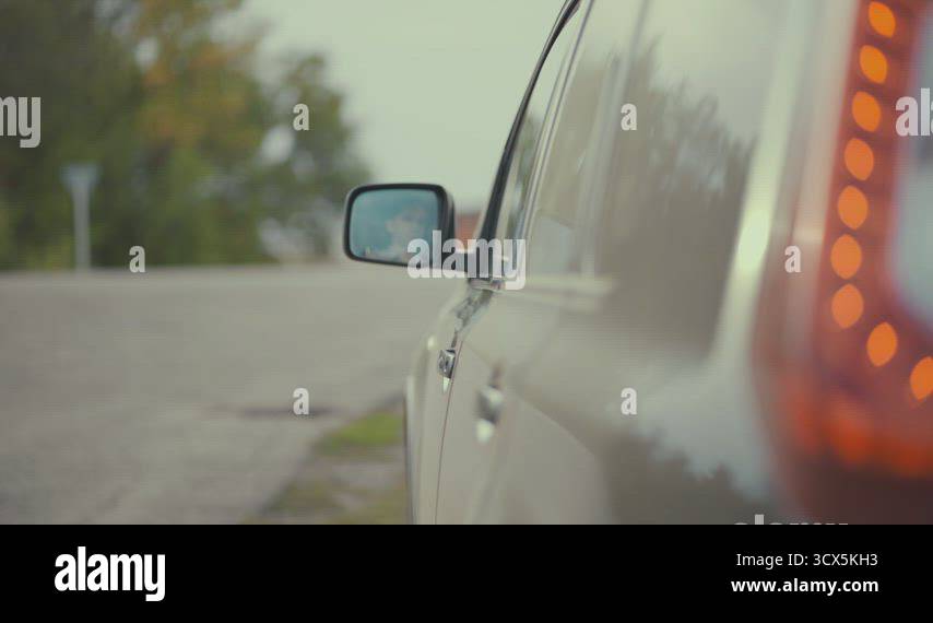 Driver throwing away medical mask from car window on road. Social ...