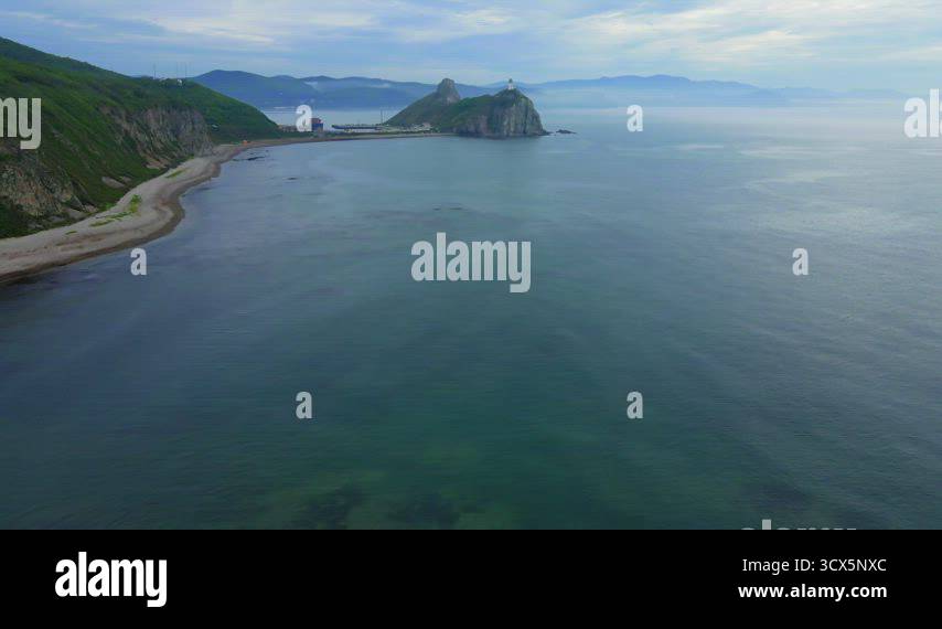 View from above. Flying over the picturesque Rudny lighthouse in the ...