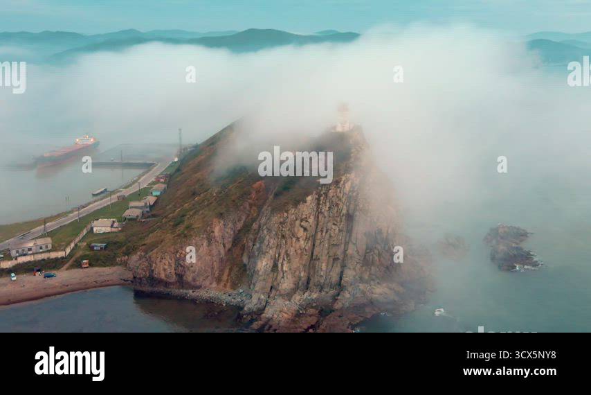 View from above. Flying over the picturesque Rudny lighthouse in the ...