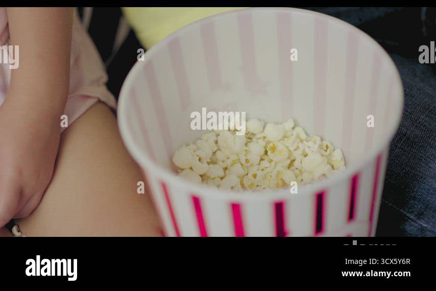 CU Children (4-5, 10-11) taking popcorn from bucket, Claremont, Cape ...