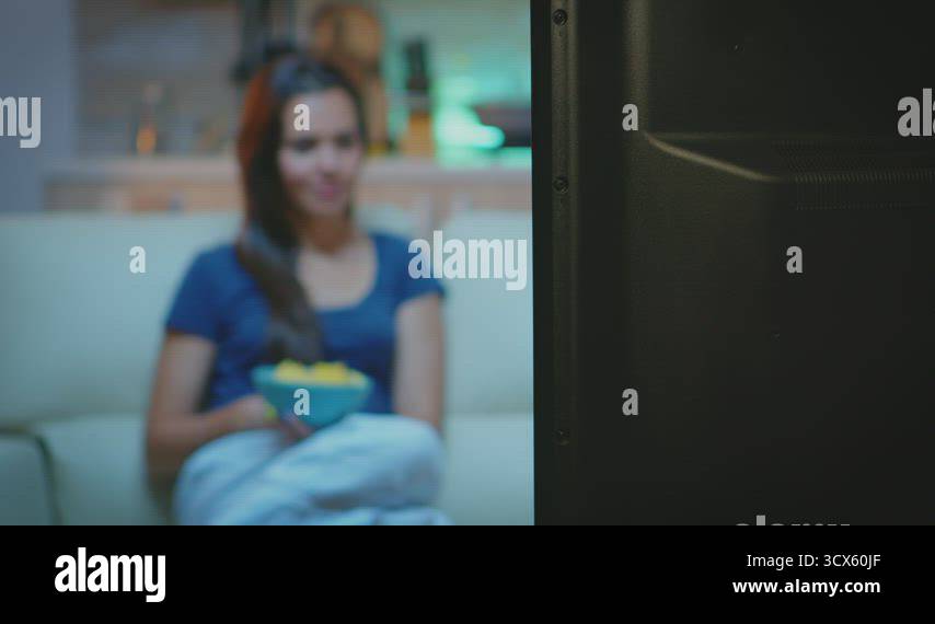 Lady eating snacks watching tv Stock Videos & Footage - HD and 4K Video ...