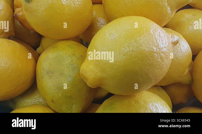 Big lemons in carton placed in market. A close up view of yellow lemons ...