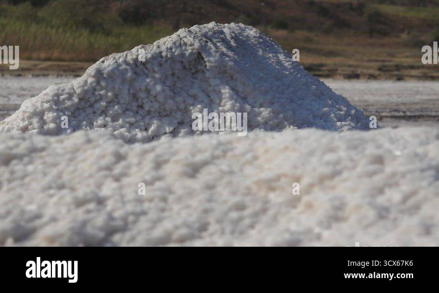 Salt lake, salt crystals. Self-settling salt covers the stones ...