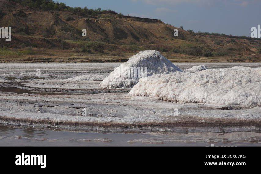 Salt lake, salt crystals. Self-settling salt covers the stones ...