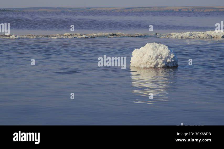 Salt lake, salt crystals. Self-settling salt covers the stones ...