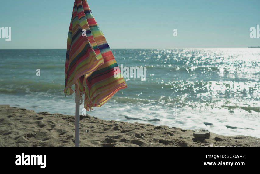 Sun umbrella folded down empty Stock Videos & Footage - HD and 4K Video ...