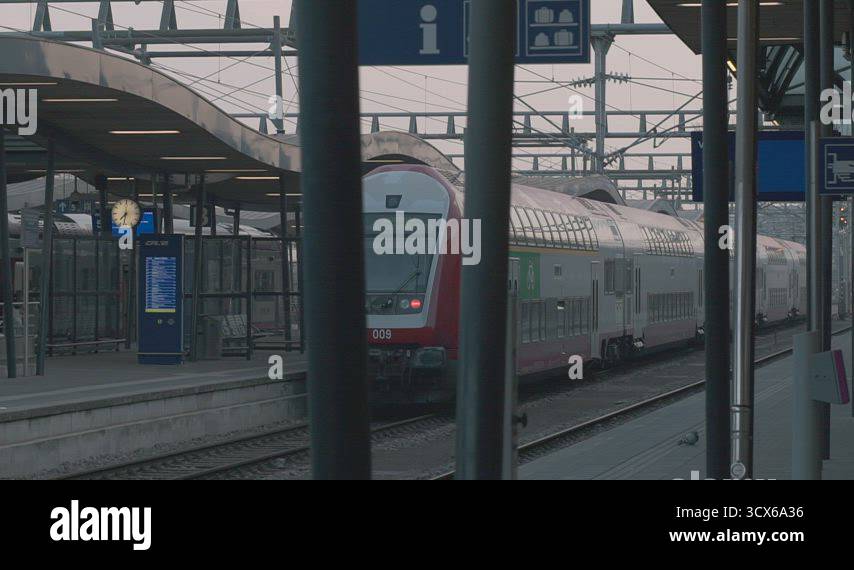 Railway train leaving the station. The train leaves the station Stock ...