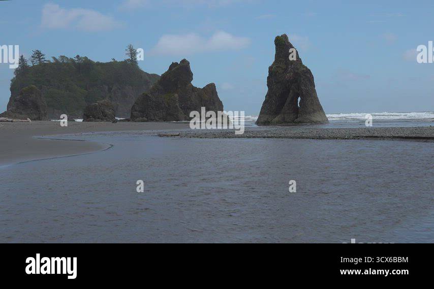 The coast of the Pacific Ocean, large cliffs and islands near the shore ...