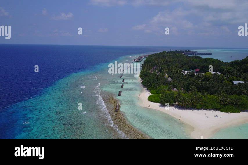 Aerial panorama of tranquil seashore beach voyage by blue ocean with ...