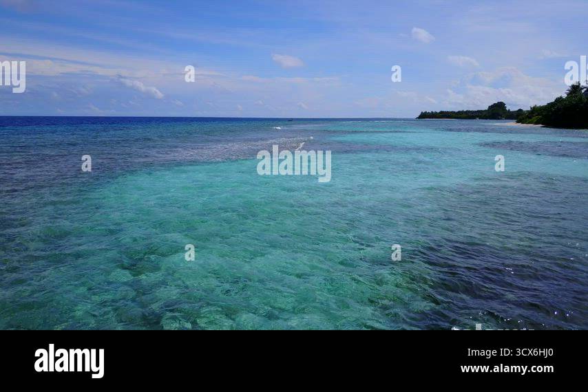 Aerial travel of relaxing island beach holiday by blue lagoon and white ...