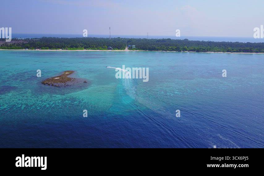 Aerial panorama of idyllic tourist beach voyage by blue water and ...