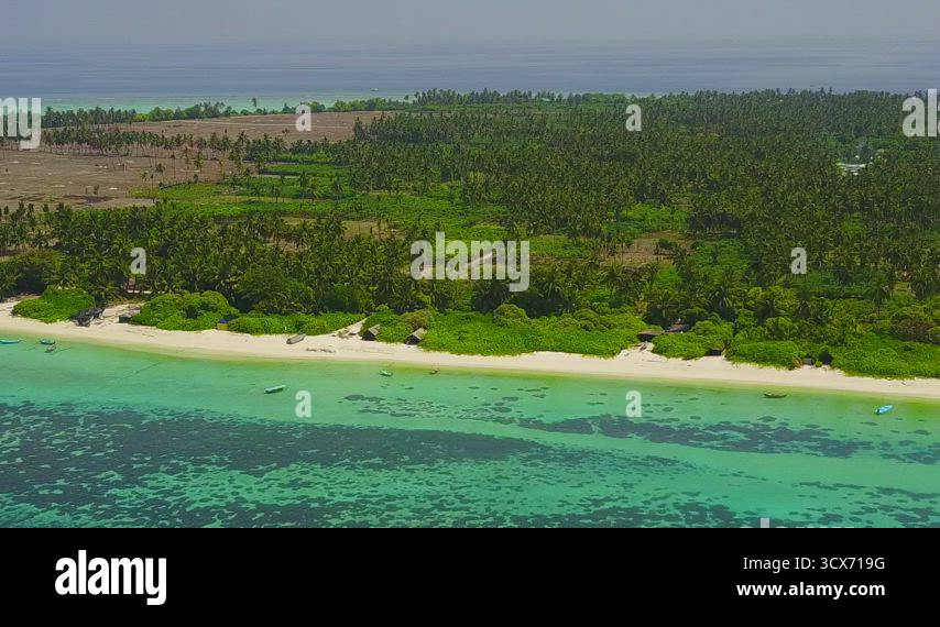 Warm panorama of exotic lagoon beach time by blue green sea with white ...