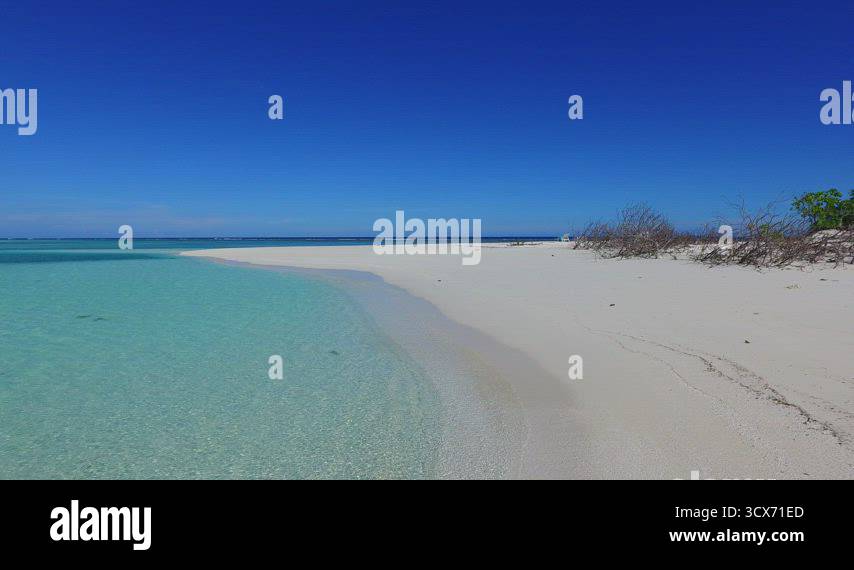 Wide angle panorama of idyllic resort beach vacation by transparent sea ...