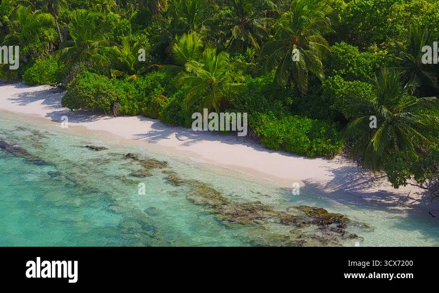 Sunny travel of marine coastline beach break by clear lagoon with ...