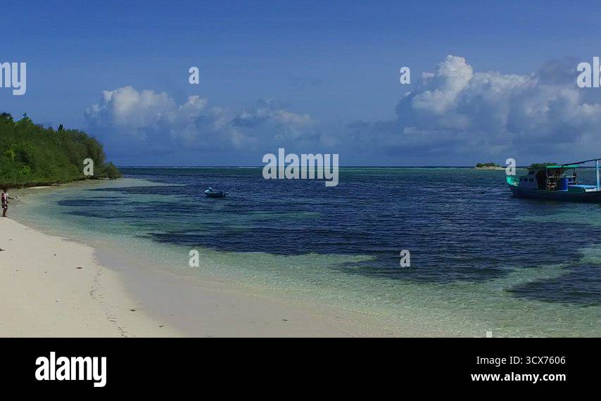 Sunny landscape of relaxing resort beach holiday by shallow sea with ...