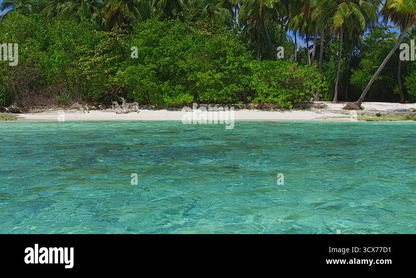 Wide angle landscape of perfect shore beach holiday by turquoise lagoon ...