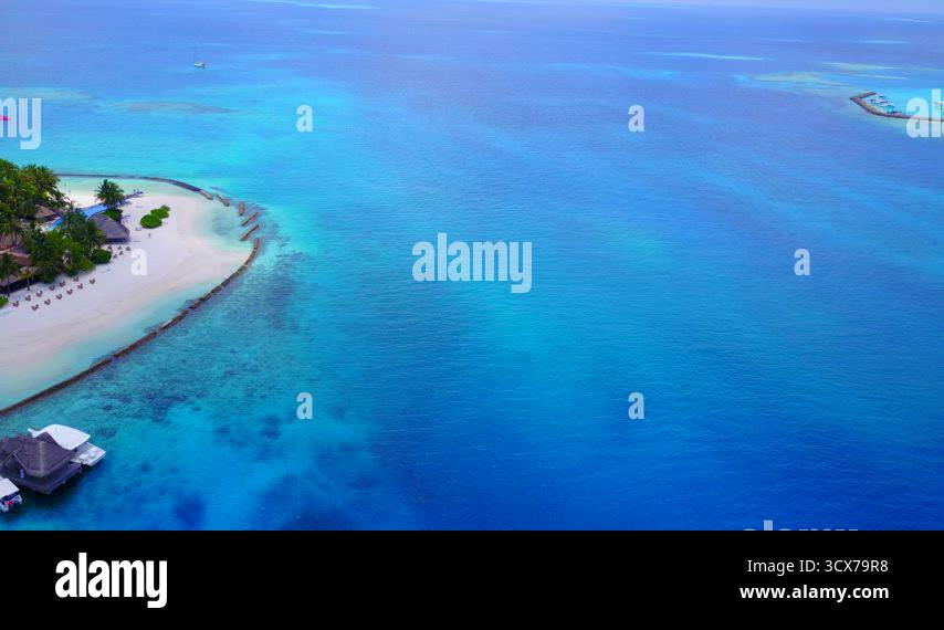 Wide angle travel of luxury coast beach vacation by transparent lagoon ...