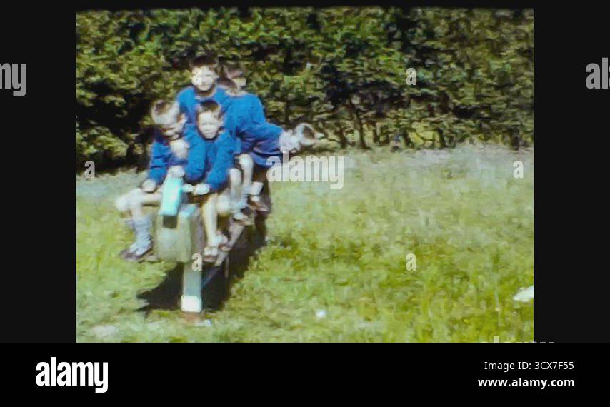 United Kingdom 1965, Children on the swing 2 Stock Video Footage - Alamy