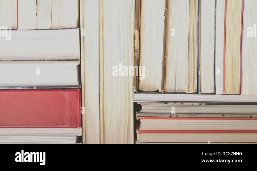 Stacks of books Stock Video Footage - Alamy