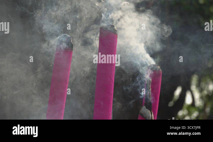 Red joss stick release smoke during burn Stock Video Footage - Alamy