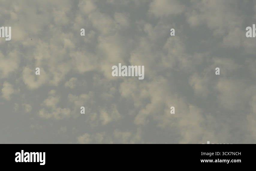 Floating clouds covering the dramatic Sky in winter sunrise time ...