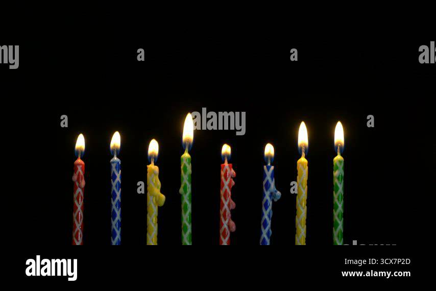 Footage colorful burning candles set on black background. 4k video ...
