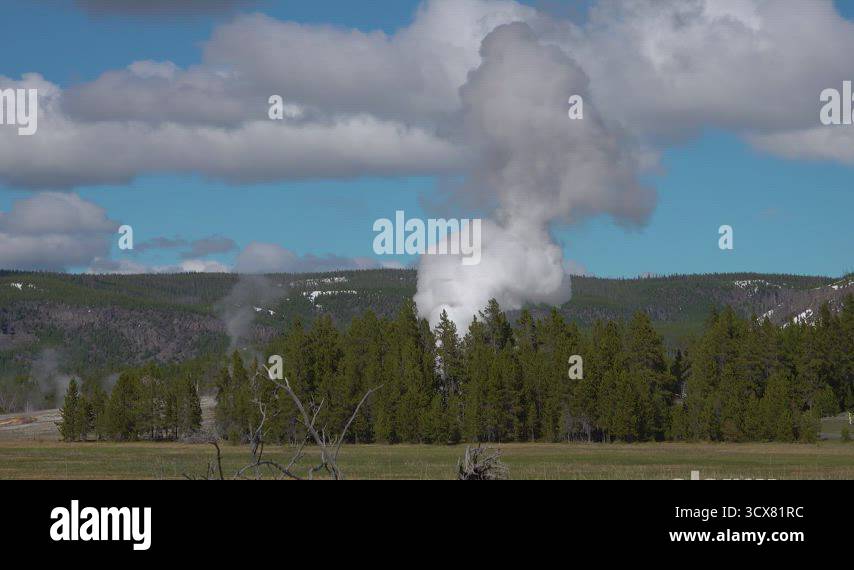 Geyser Old Faithful erupts in Yellowstone National Park in Wyoming, USA ...