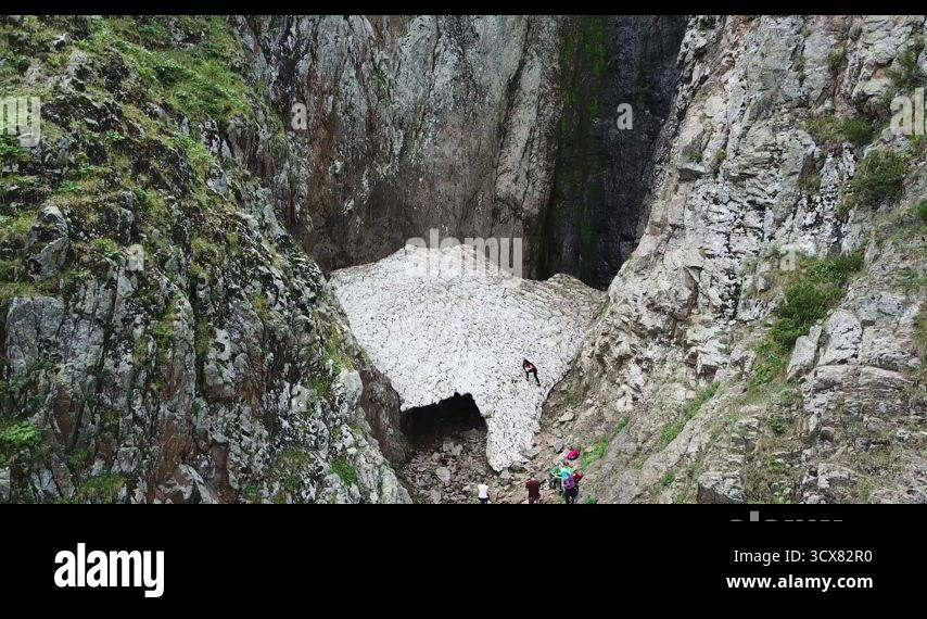 A group of people near a snow cave. Top view Stock Video Footage - Alamy