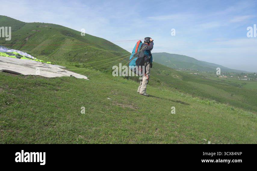 Beginning of paragliding. Wing of paraglider rises Stock Video Footage ...