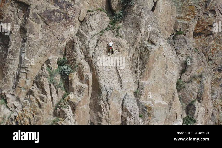 Man climbs up cliff active Stock Videos & Footage - HD and 4K Video ...