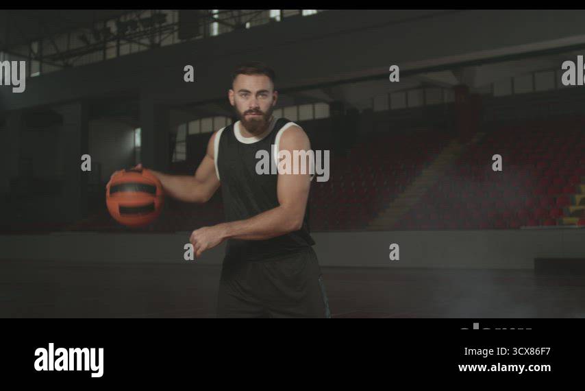 Video portrait of a basketball player bouncing a ball. Caucasian man in ...