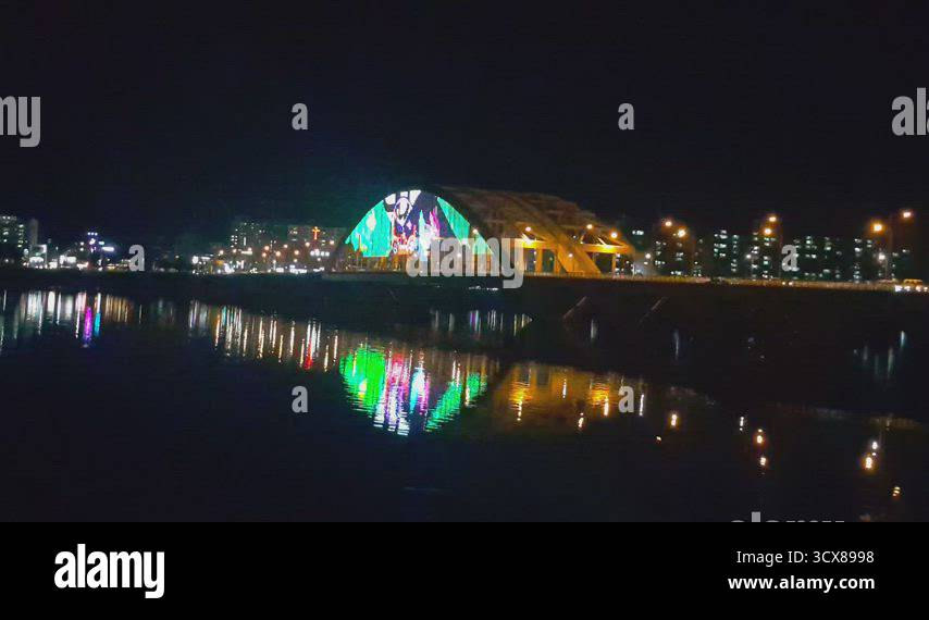 Night view of a beautiful scene of bridge over sea water in the evening ...