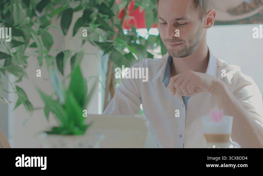 Happy Laughing Customer Makes Video Call in a Cafe Using Tablet PC ...