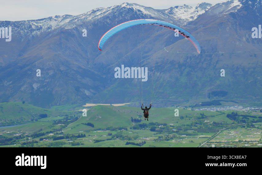 Paragliding activity take place at Coronet Peak. The background is ...