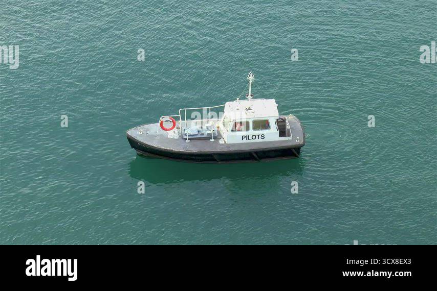 Pilot boat pulls alongside a cruise ship Stock Video Footage - Alamy