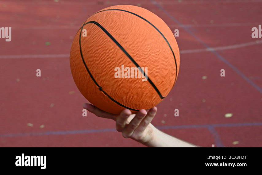Man spinning basketball ball on hand palm Stock Video Footage - Alamy
